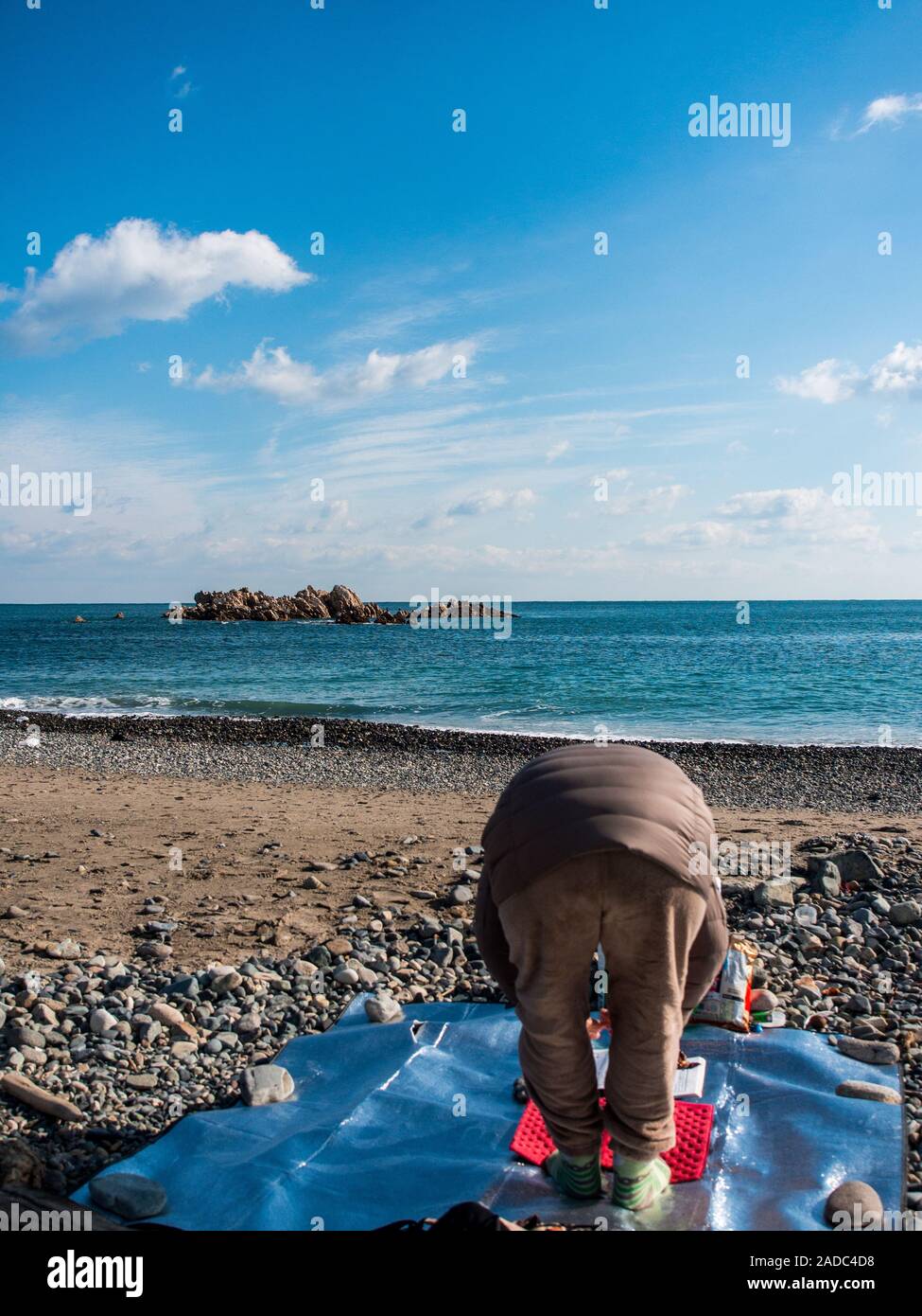 Woman shaman performing shamanist ritual, ocean beach, near underwater ...