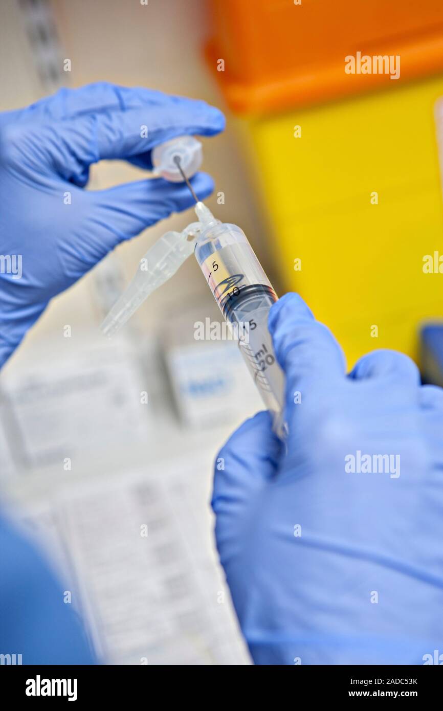 Preparing hospital drugs. Close-up of a hospital nurse preparing ...