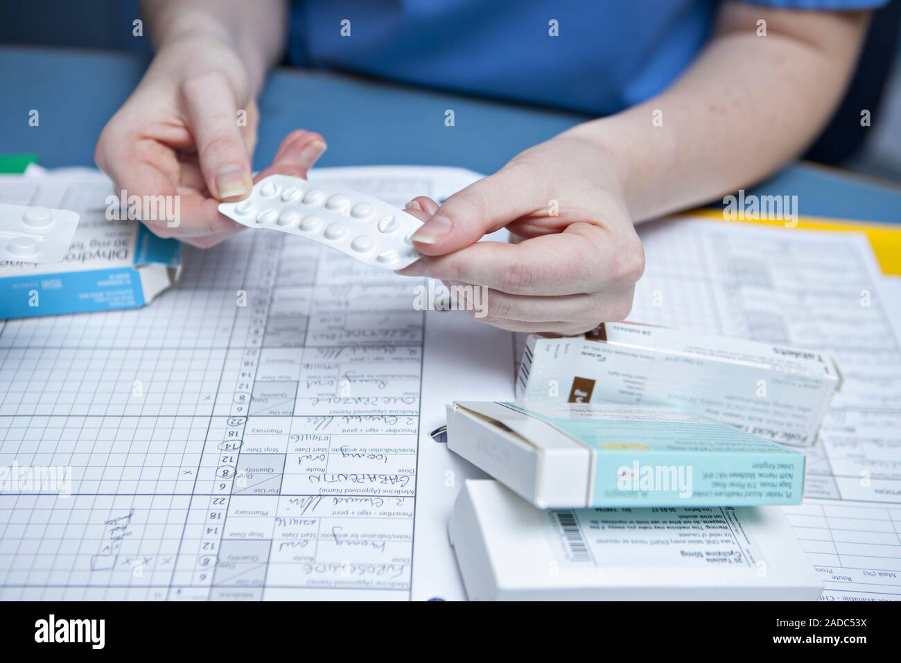 Preparing hospital drugs. Close-up of a hospital nurse preparing drugs ...