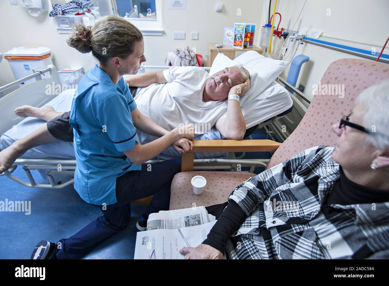 Respiratory physiotherapy training. Lung patient being taught a ...