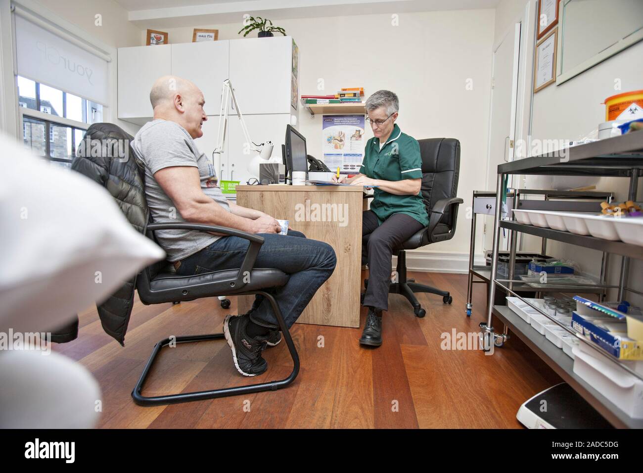 Medical consultation. Paramedic at a general practice (GP) clinic ...