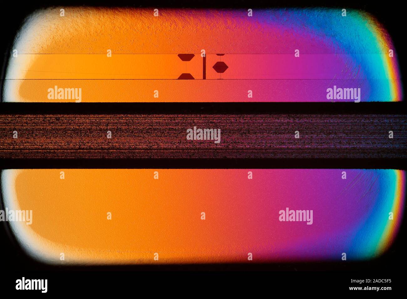 Light micrograph of a read-write magnetic ferrite head from a 3.5-inch ...