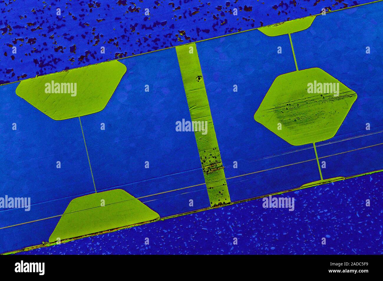 Light micrograph of a read-write magnetic ferrite head from a 3.5-inch ...