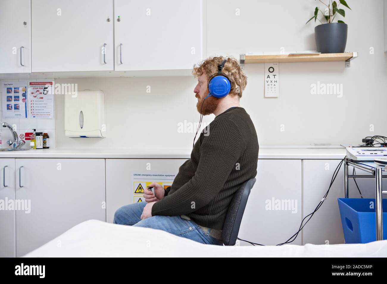 Employment-related hearing test. Patient having an employment-related ...