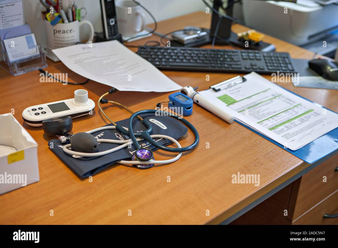 Doctor's desk and equipment. Desk at a general practice (GP) clinic ...