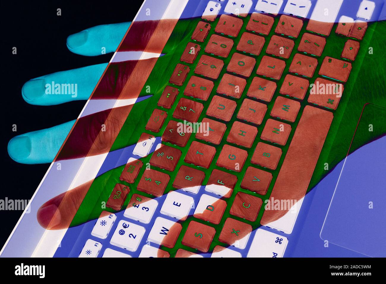 Virtual keyboard, conceptual image. Human hand and a computer keyboard ...