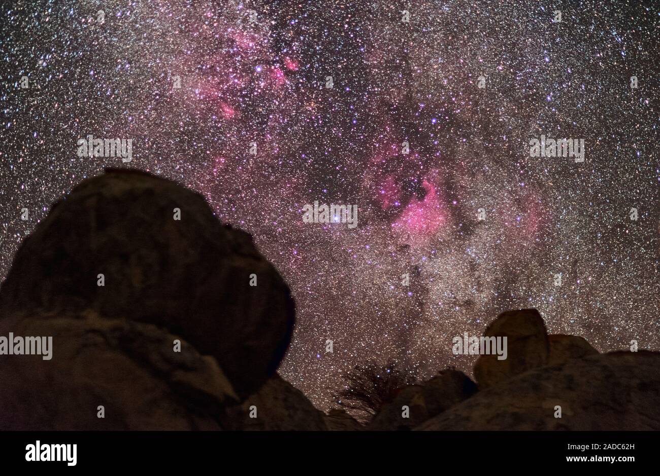Nebulae over rocks in Namibia. These nebulae are in the constellation ...