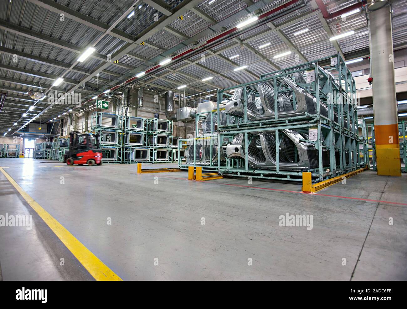 Mini car factory. Mini body parts stacked ready for the robotic ...