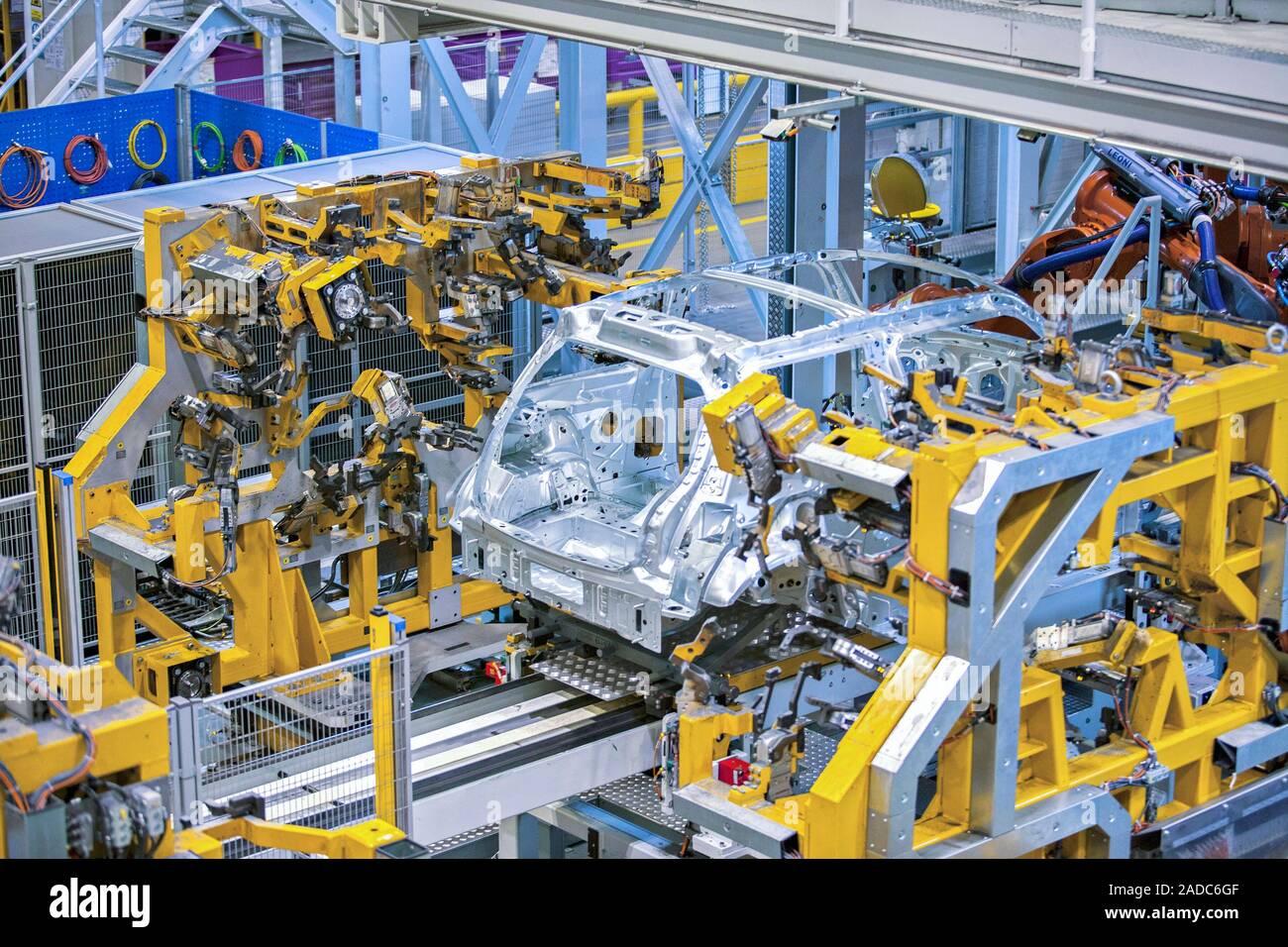 Mini car factory. Mini on the robotic assembly line at BMW's Plant ...