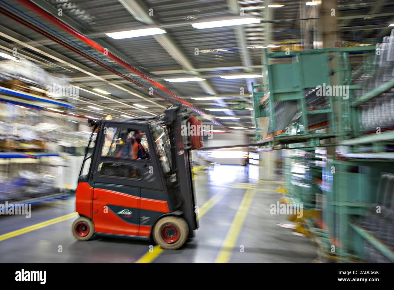 Mini car factory. Mini body parts stacked ready for the robotic ...