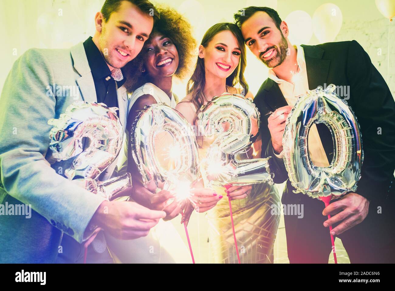 Group of party people celebrating the arrival of 2020 Stock Photo - Alamy
