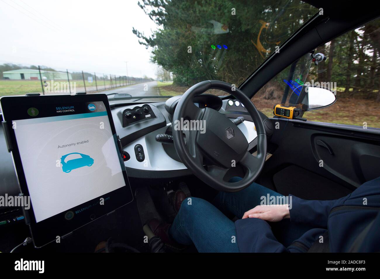 Interior of GENI driverless car, with the tablet control panel stating that autonomy has been ...