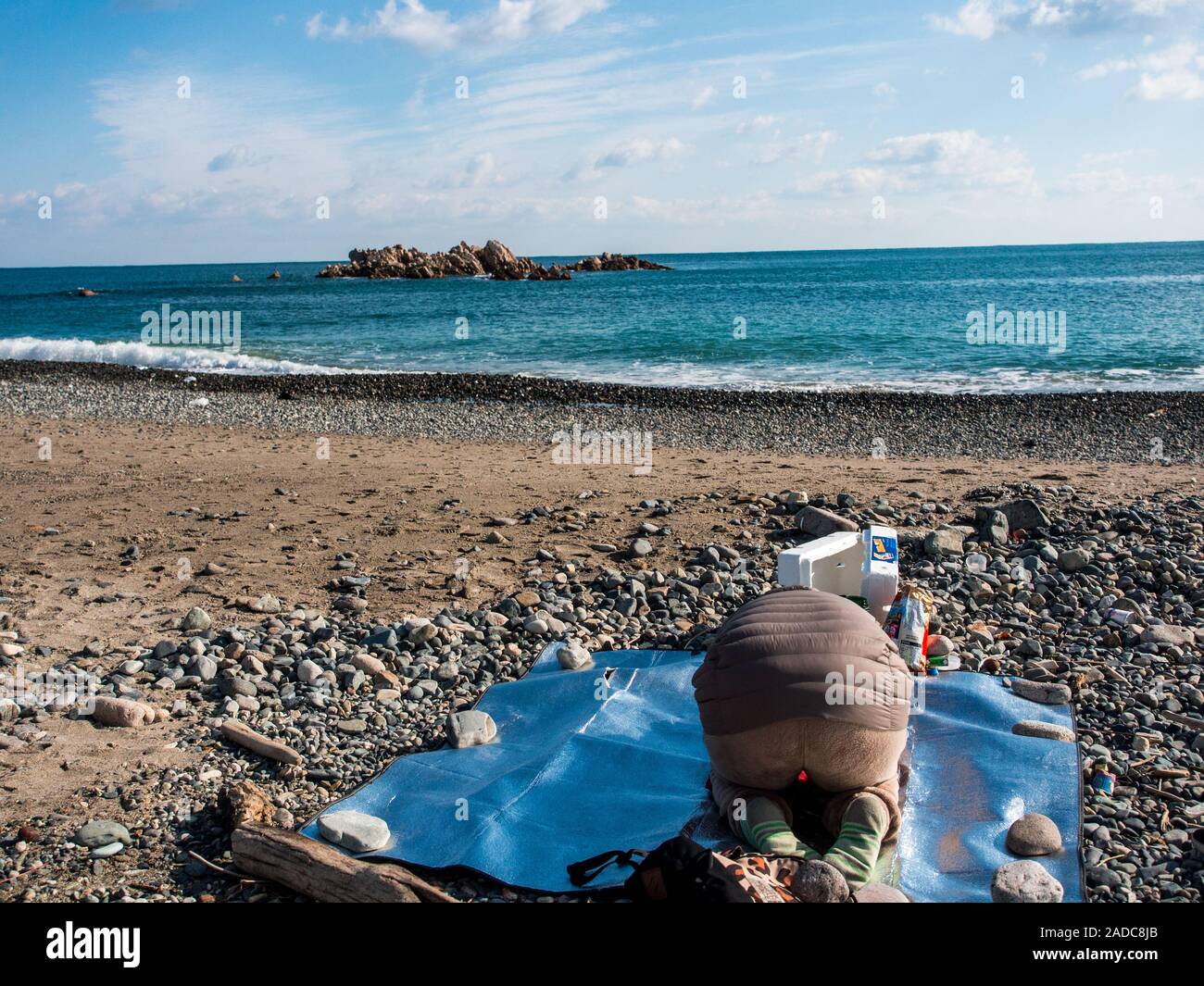 Woman shaman performing shamanist ritual, ocean beach, near underwater ...