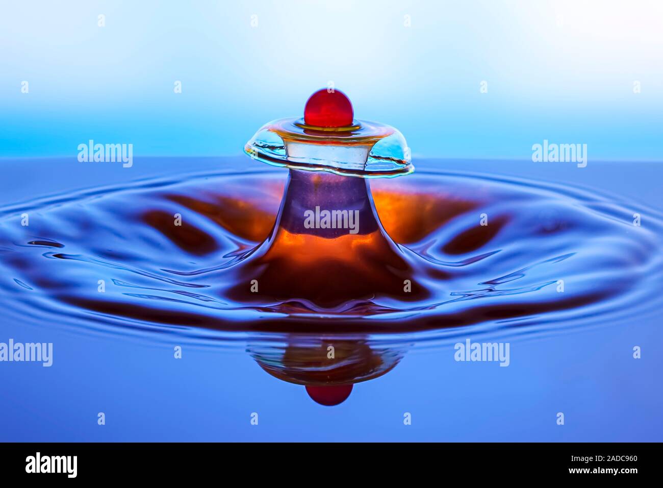 Water drop impact. High-speed photograph of secondary drop formation ...