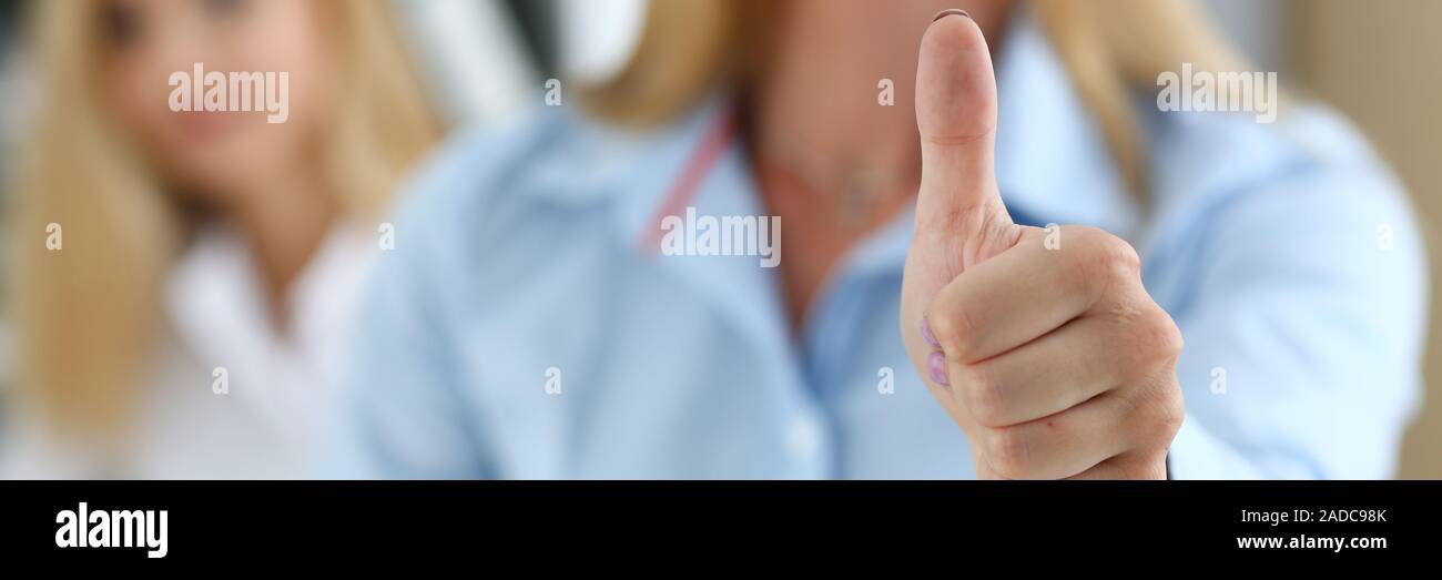 Female arm show OK or approval with thumb up Stock Photo - Alamy
