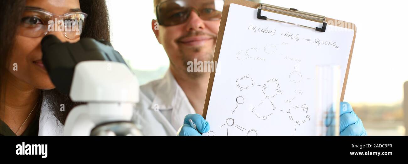 Two scientists of a student chemist are conducting Stock Photo - Alamy