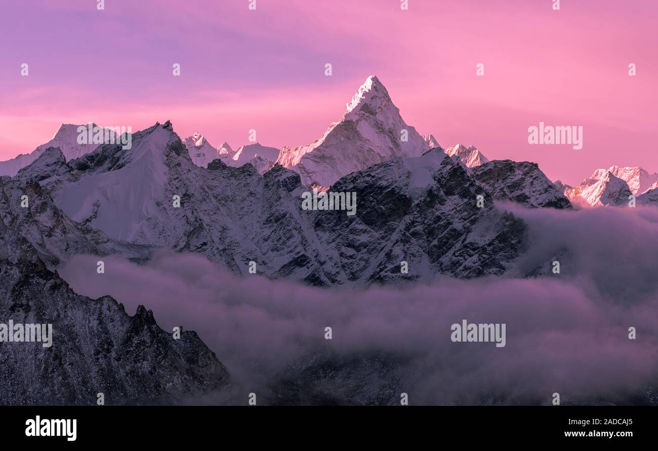 Game of tender pink halftones at sunrise; majestic Ama Dablam peak ...