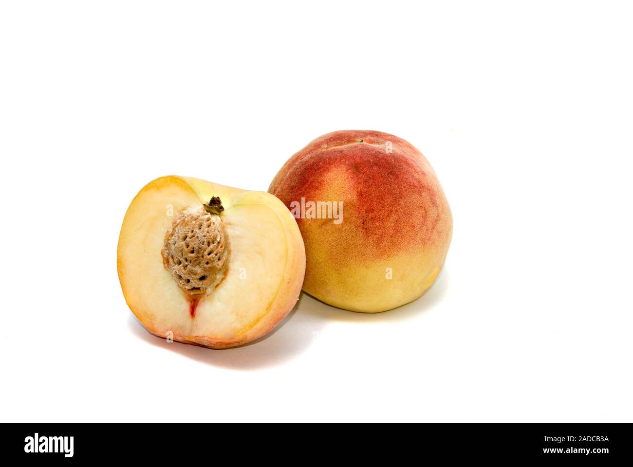 Peach and its section isolated on white background Stock Photo - Alamy