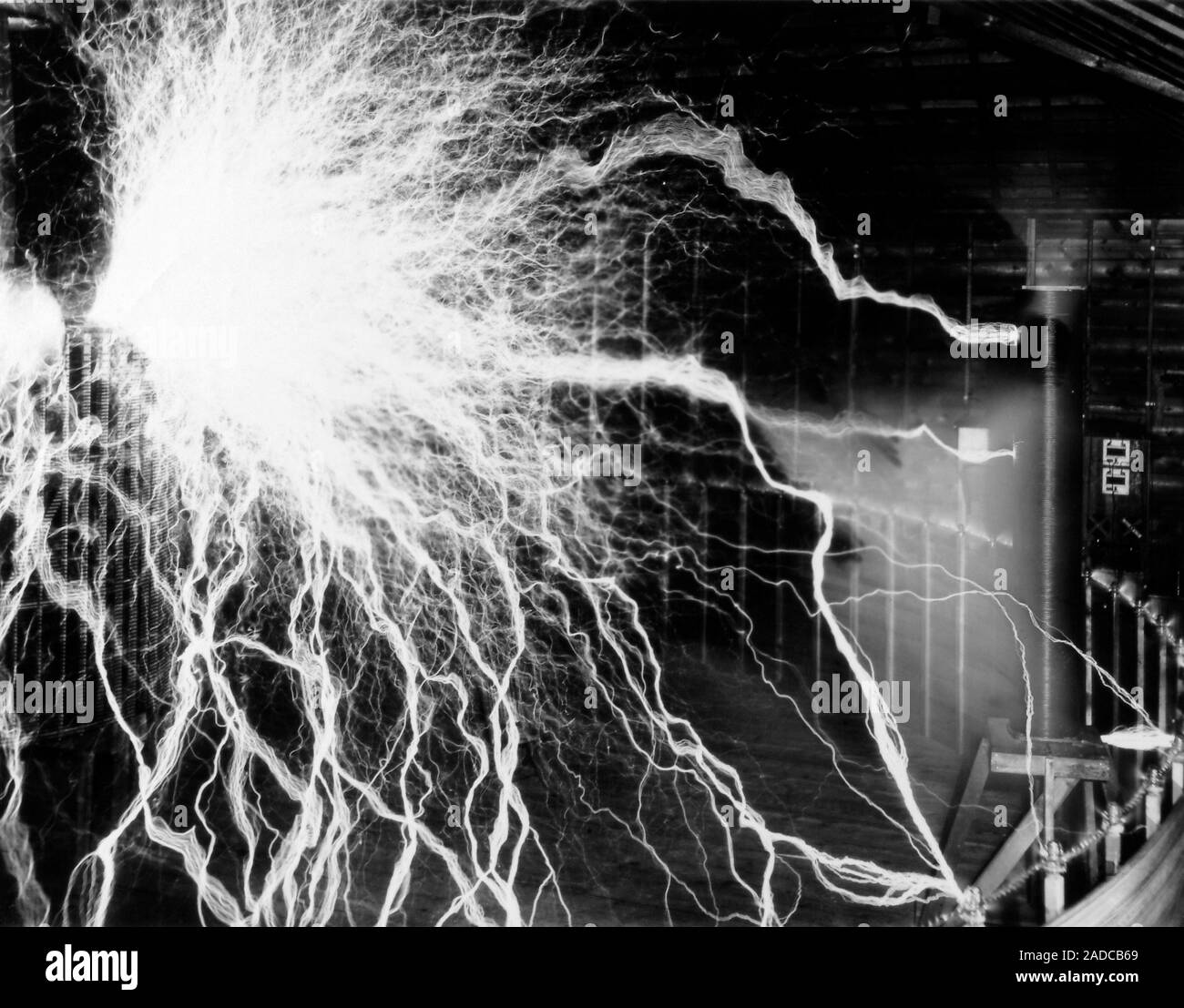 Tesla coil experiment. Electrical streamers sparking to and from a coil ...