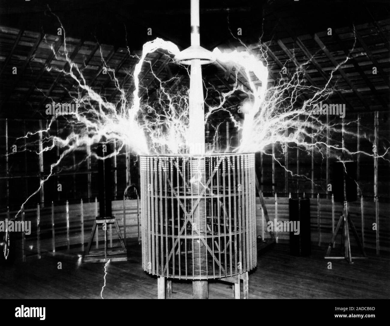 Tesla coil experiment. Electrical streamers sparking to and from a coil ...