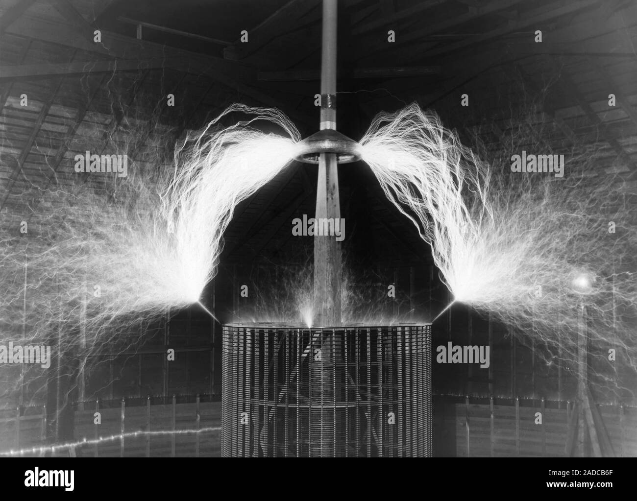 Tesla coil experiment. Electrical streamers sparking to and from a coil ...