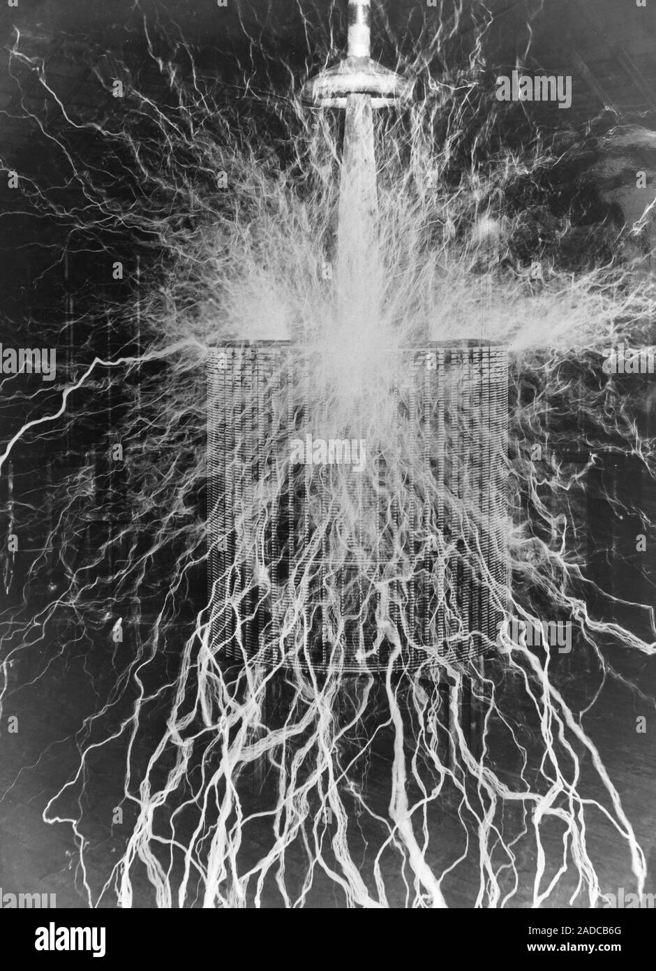 Tesla coil experiment. Electrical streamers sparking to and from a coil ...