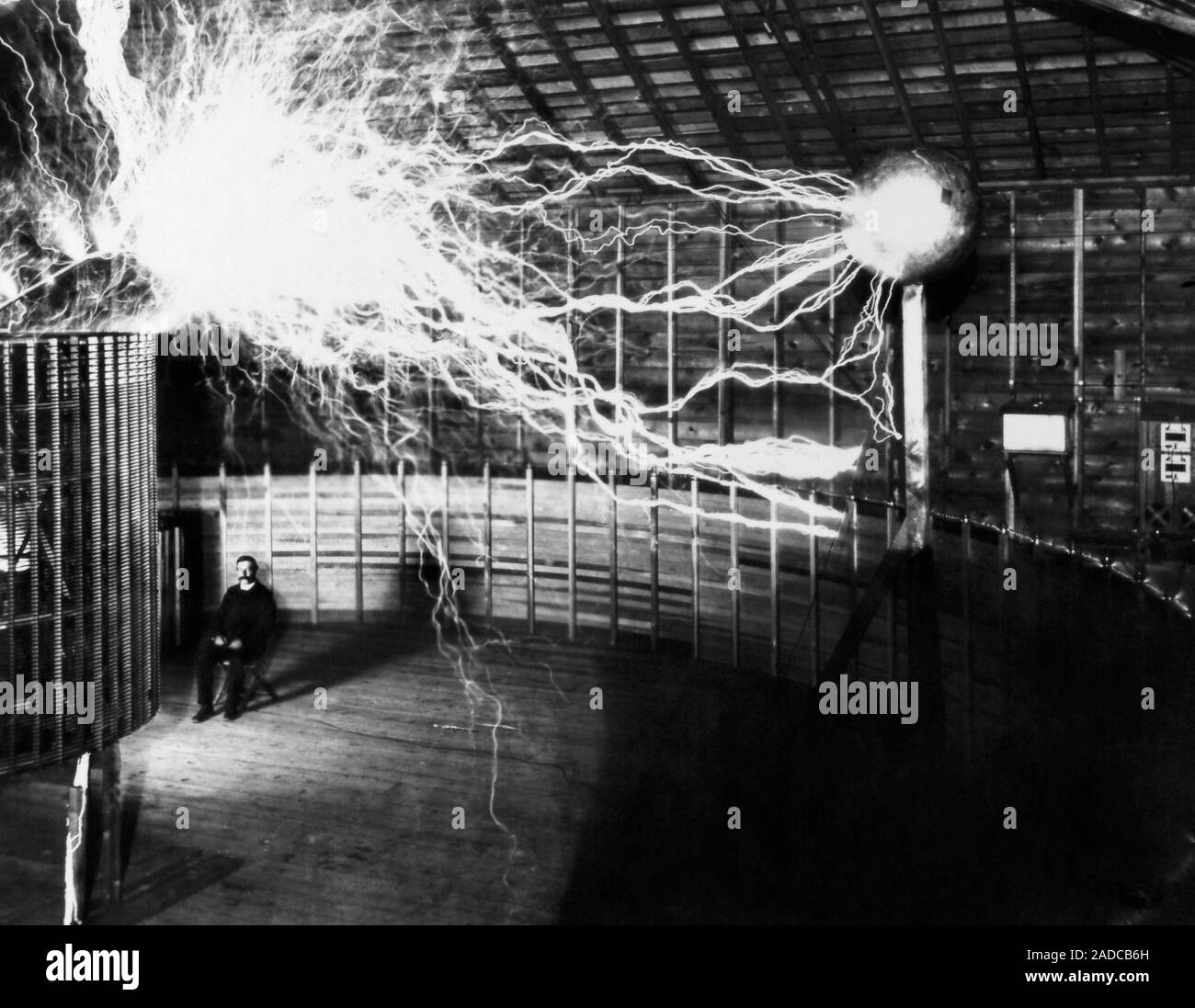 Tesla coil experiment. Electrical streamers sparking outwards from a ...