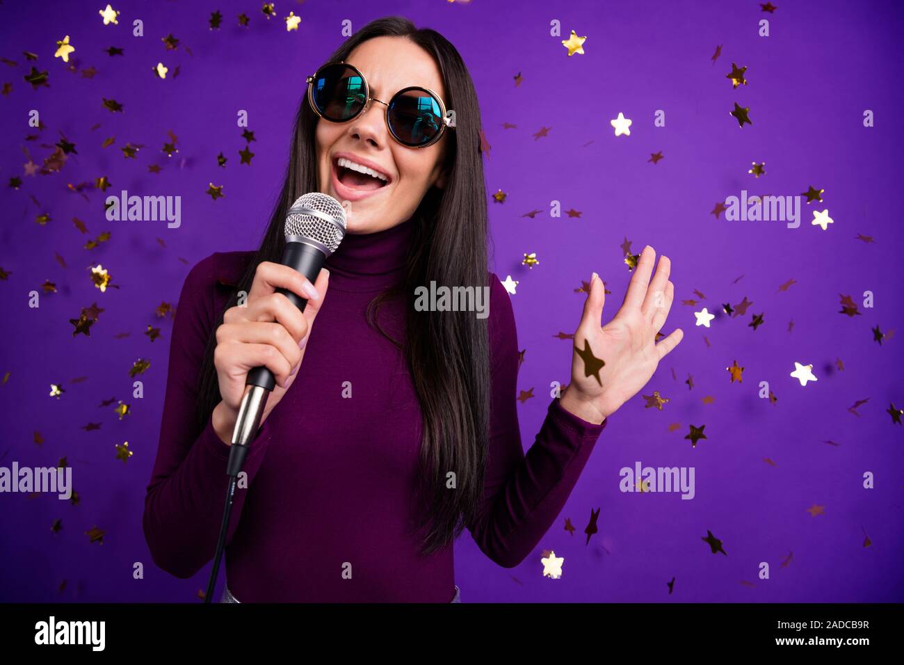 Photo of trendy cute attractive rock star singing into microphone ...