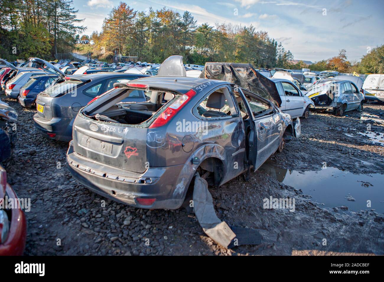 Scrapyard. Cars ready to be broken up and dismantled at a scrapyard ...
