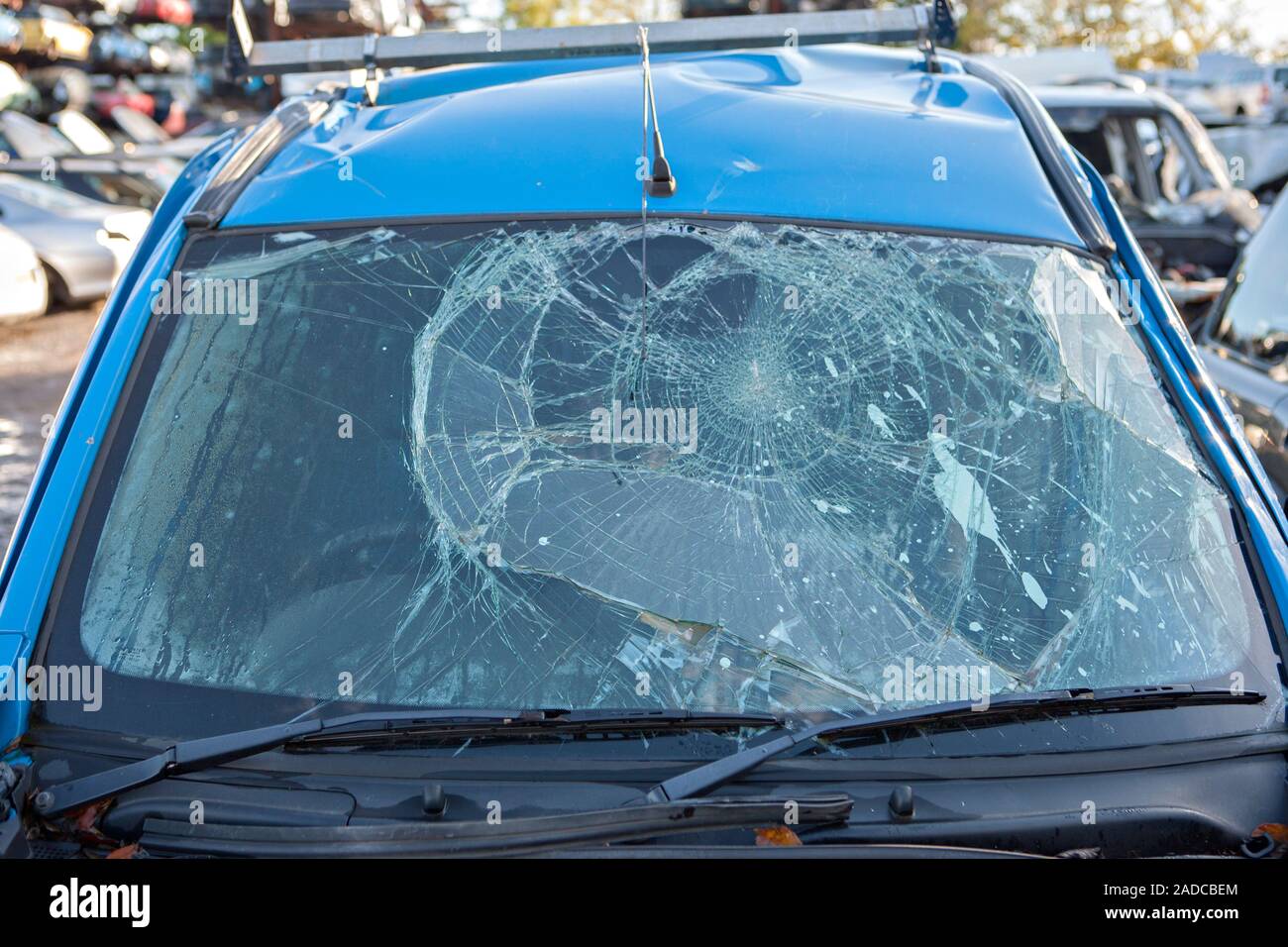 Scrapyard. Close-up of the smashed windscreen of a car at a scrapyard ...