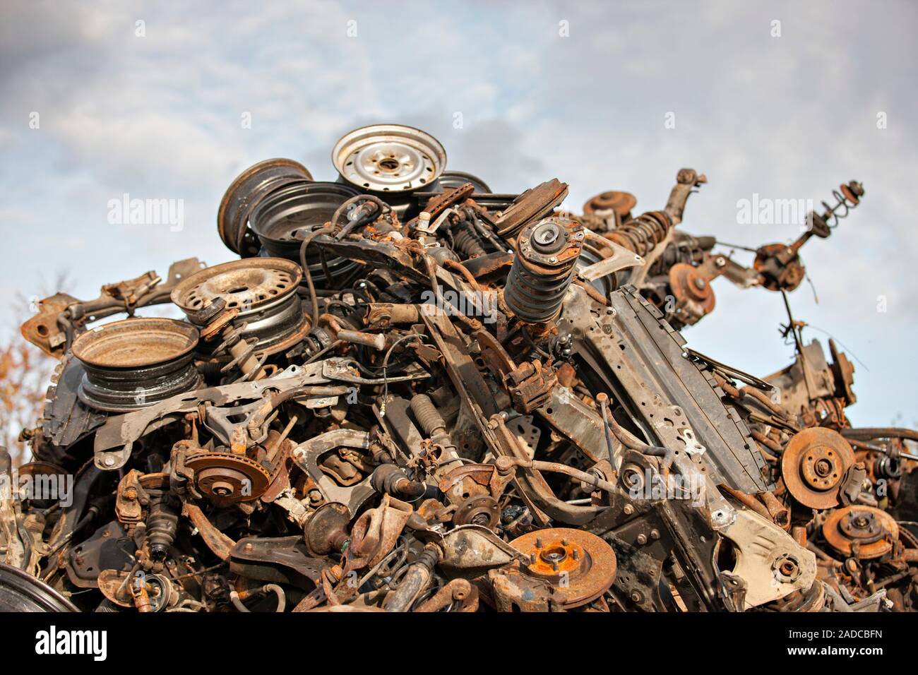 Scrapyard. Dismantled vehicle parts ready for recycling at a scrapyard ...