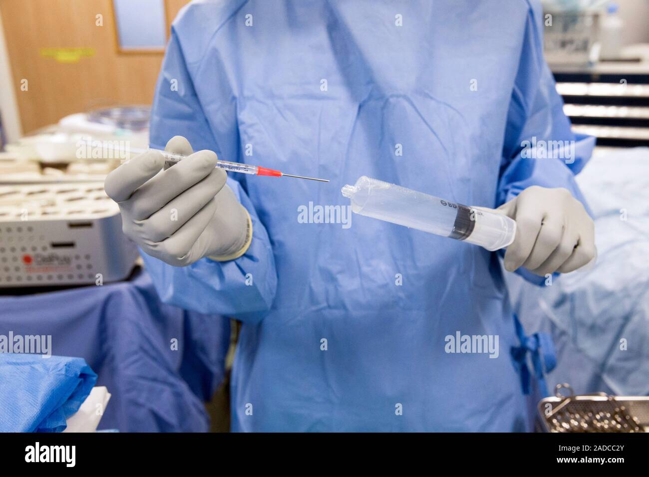 Preparing surgical equipment. Close-up of a surgical staff member ...