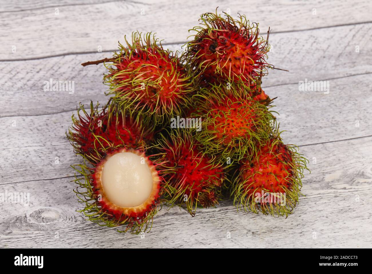 Tropical sweet exotic fruit Rambutan heap Stock Photo - Alamy