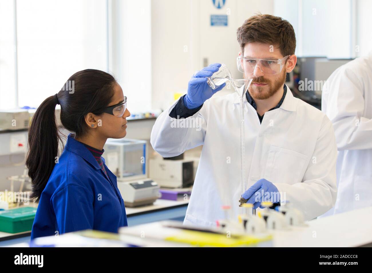 Chemistry student in an undergraduate teaching laboratory carrying out ...