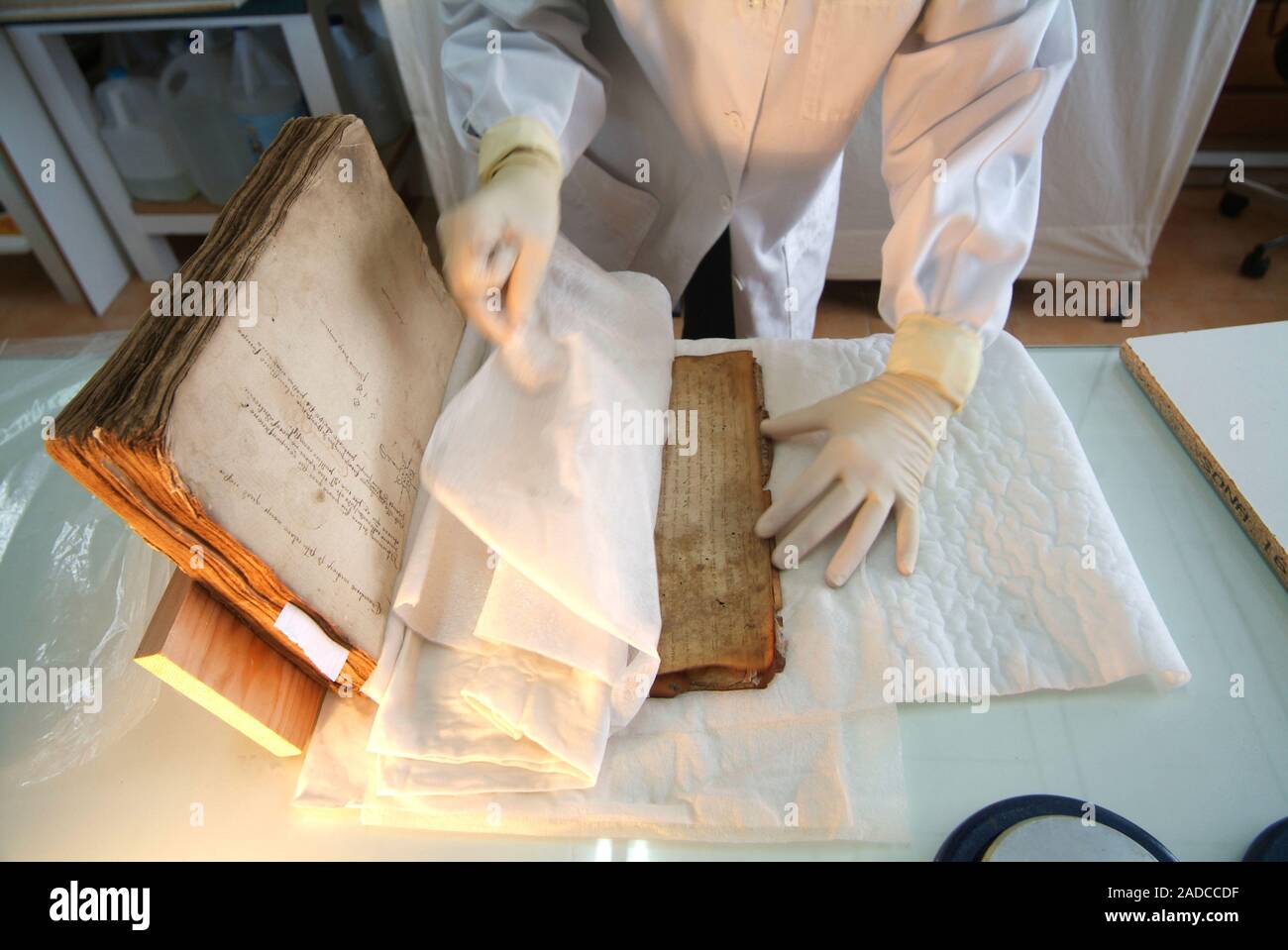 Jewish medieval heritage, document recovery. Restorer removing the ...