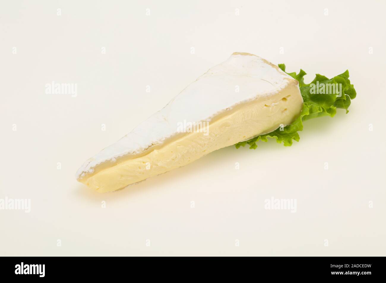 Brie cheese triangle served salad leaves Stock Photo - Alamy