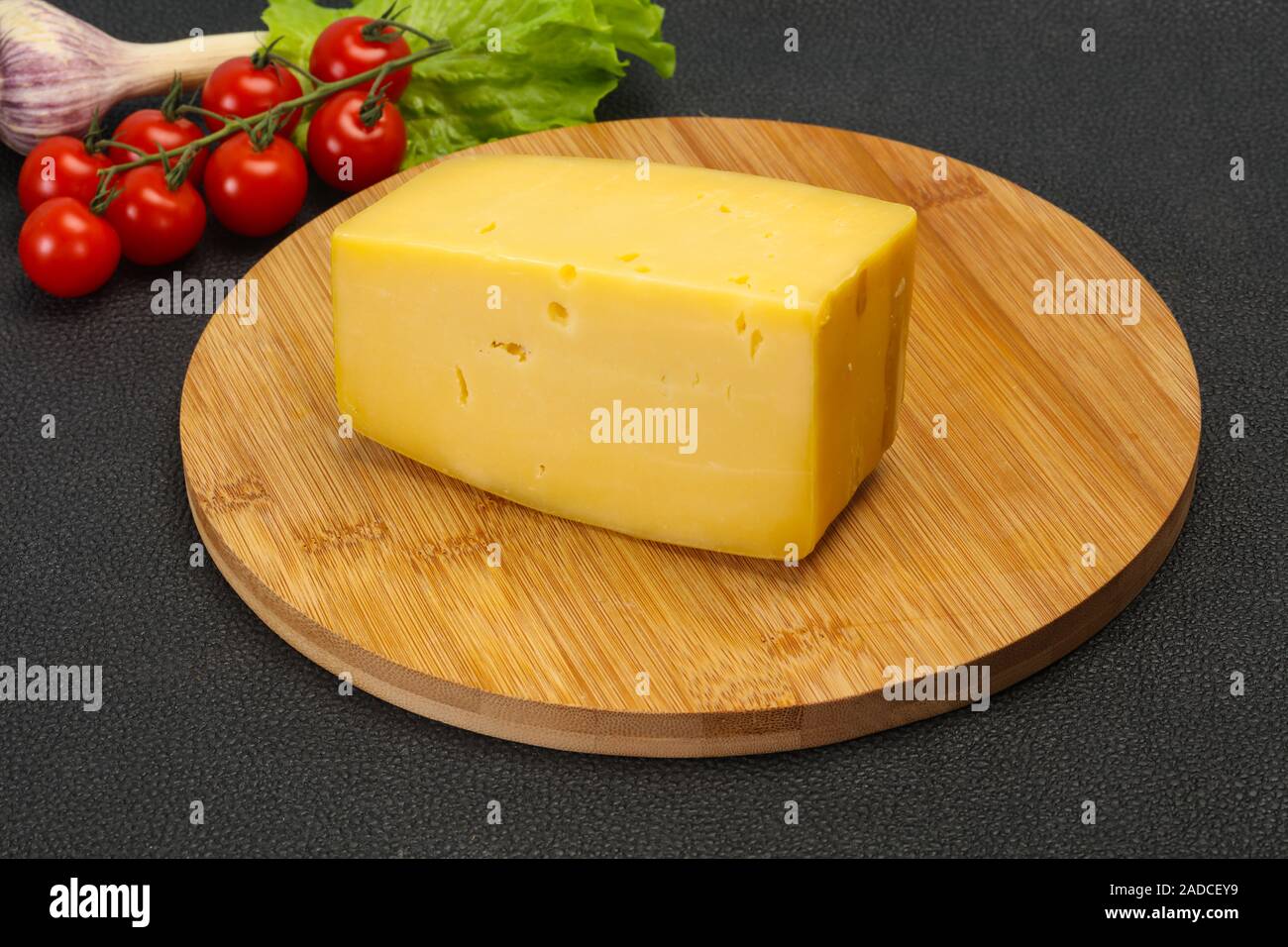 Swiss Hard yellow tasty cheese brick Stock Photo - Alamy