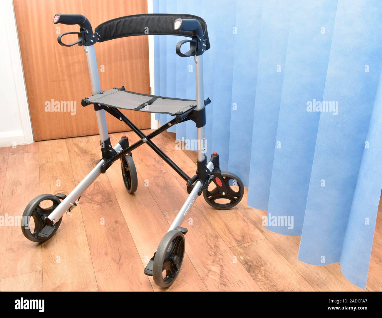 Mobility frame with wheels and seat Stock Photo - Alamy