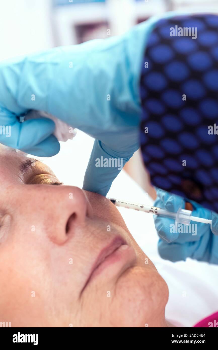 Botox treatment, anti-wrinkle treatment. Patient having botox injected ...