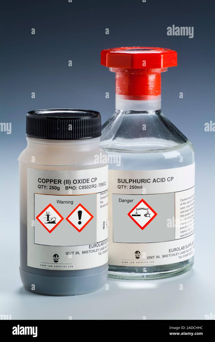 Container of copper (II) oxide (left) and a bottle of sulphuric acid ...