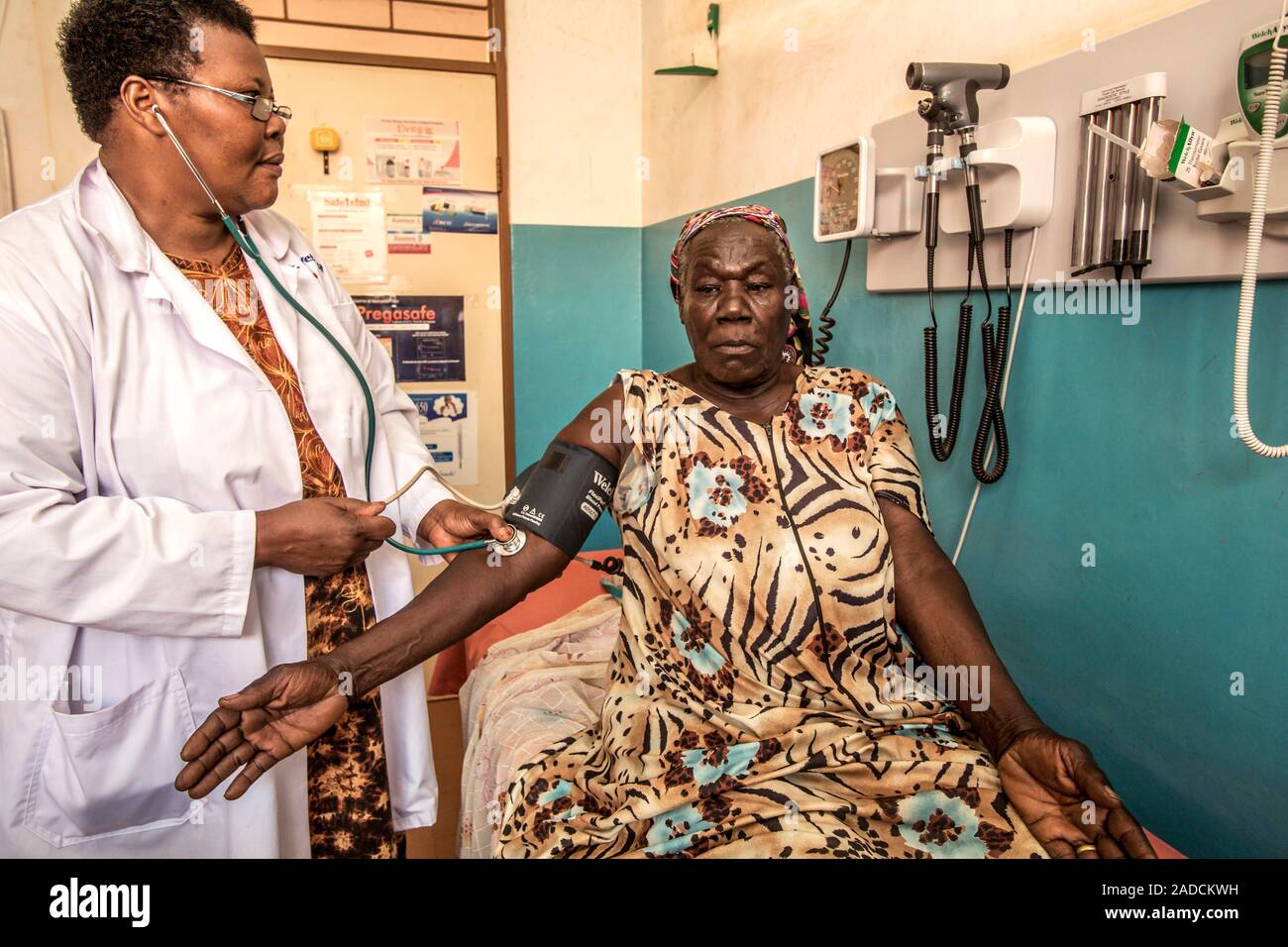 Hospital blood pressure measurement. Hospital doctor measuring a ...