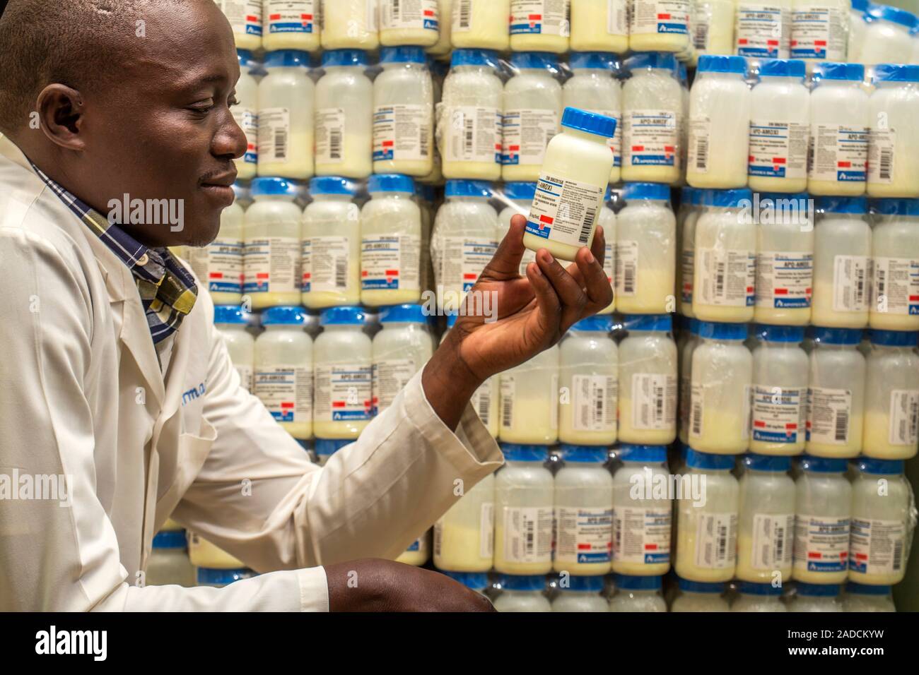 Pharmacist handling antibiotics. Bottle of an oral suspension of the ...
