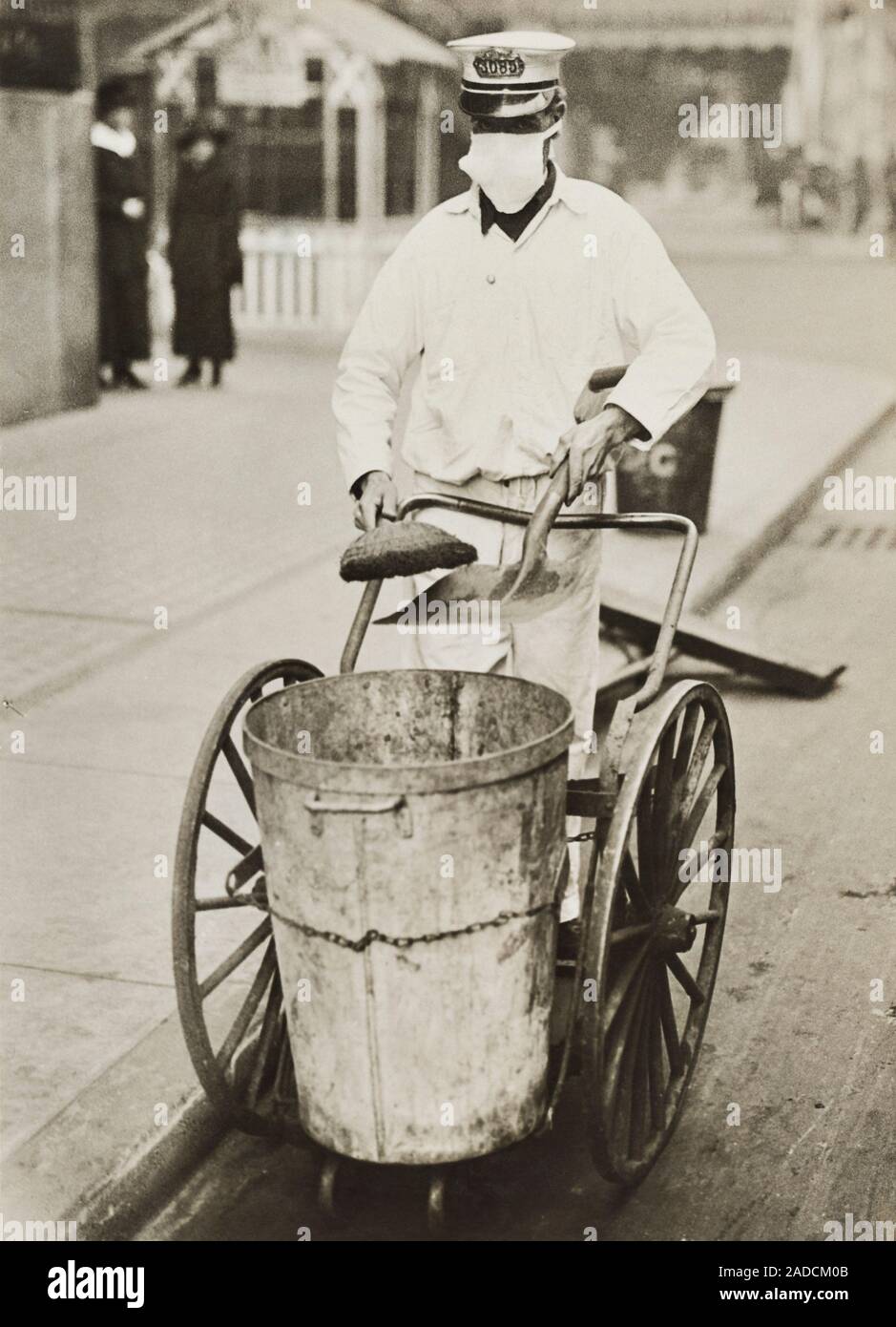 Street sweeper during the Spanish Flu pandemic. Wearing face masks was ...