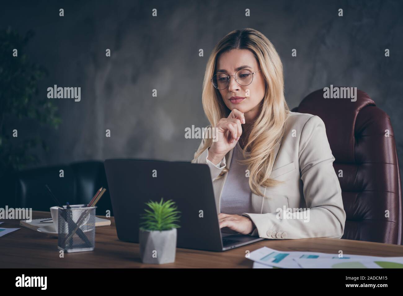 Photo of concentrated confident smart clever lady solving buciness ...