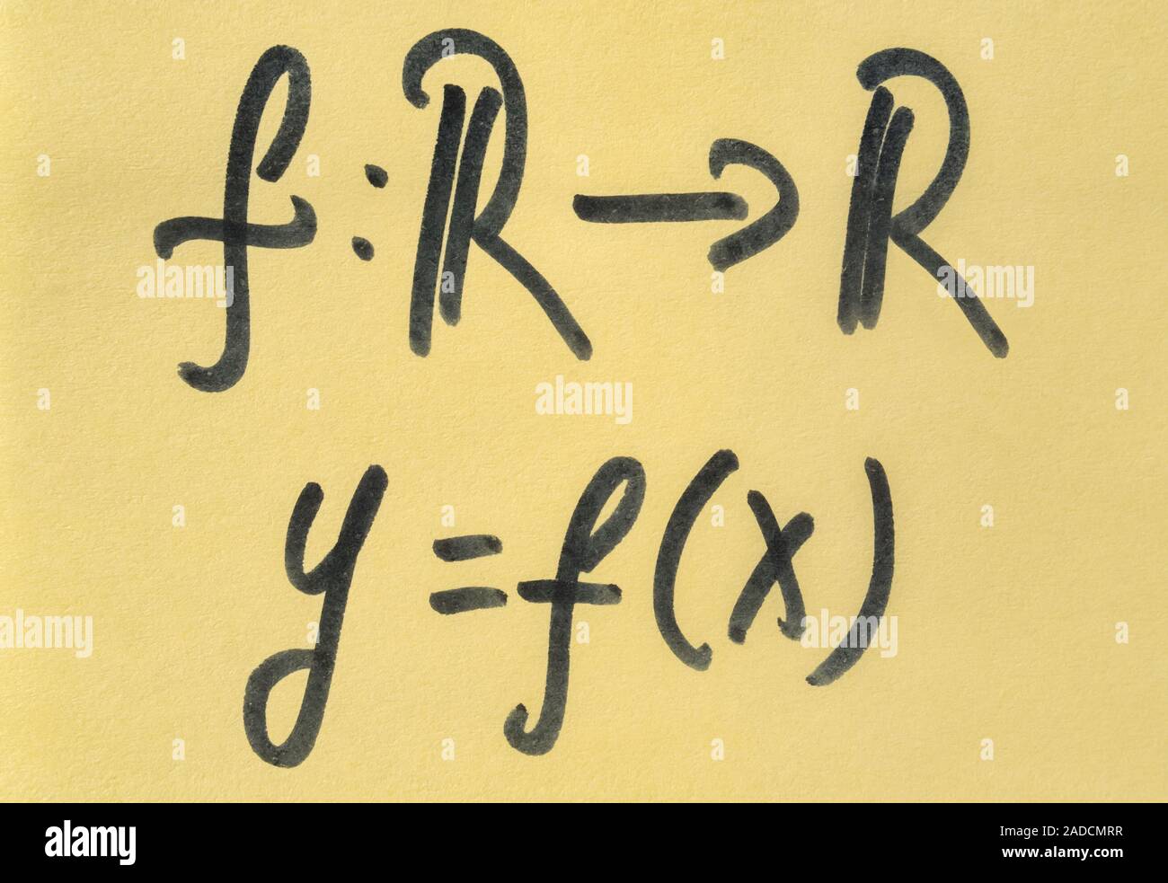 Definition of a real valued function and a pencil on bright background ...