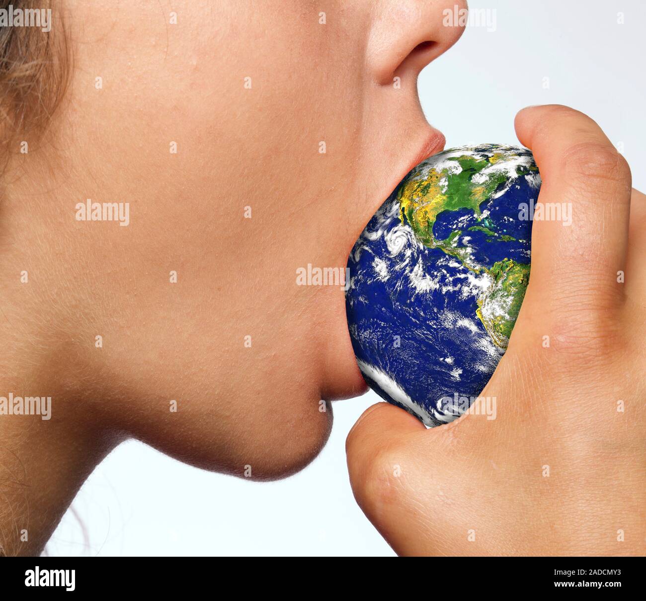 Eating the Earth. Conceptual illustration of the Earth being eaten ...