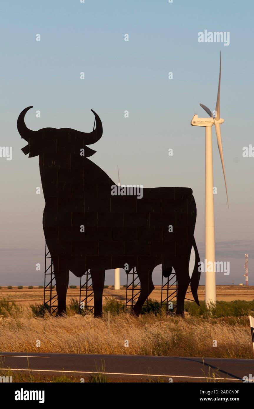 Bull advertising sign and wind turbine. This Spanish bull sign (known ...