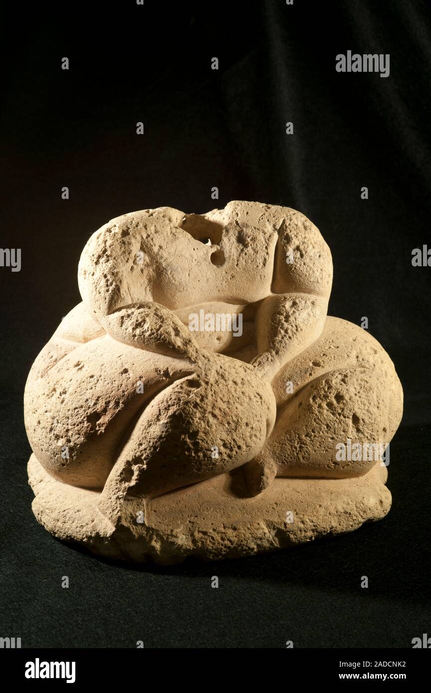 Prehistoric limestone figure. Headless seated statuette carved out of ...