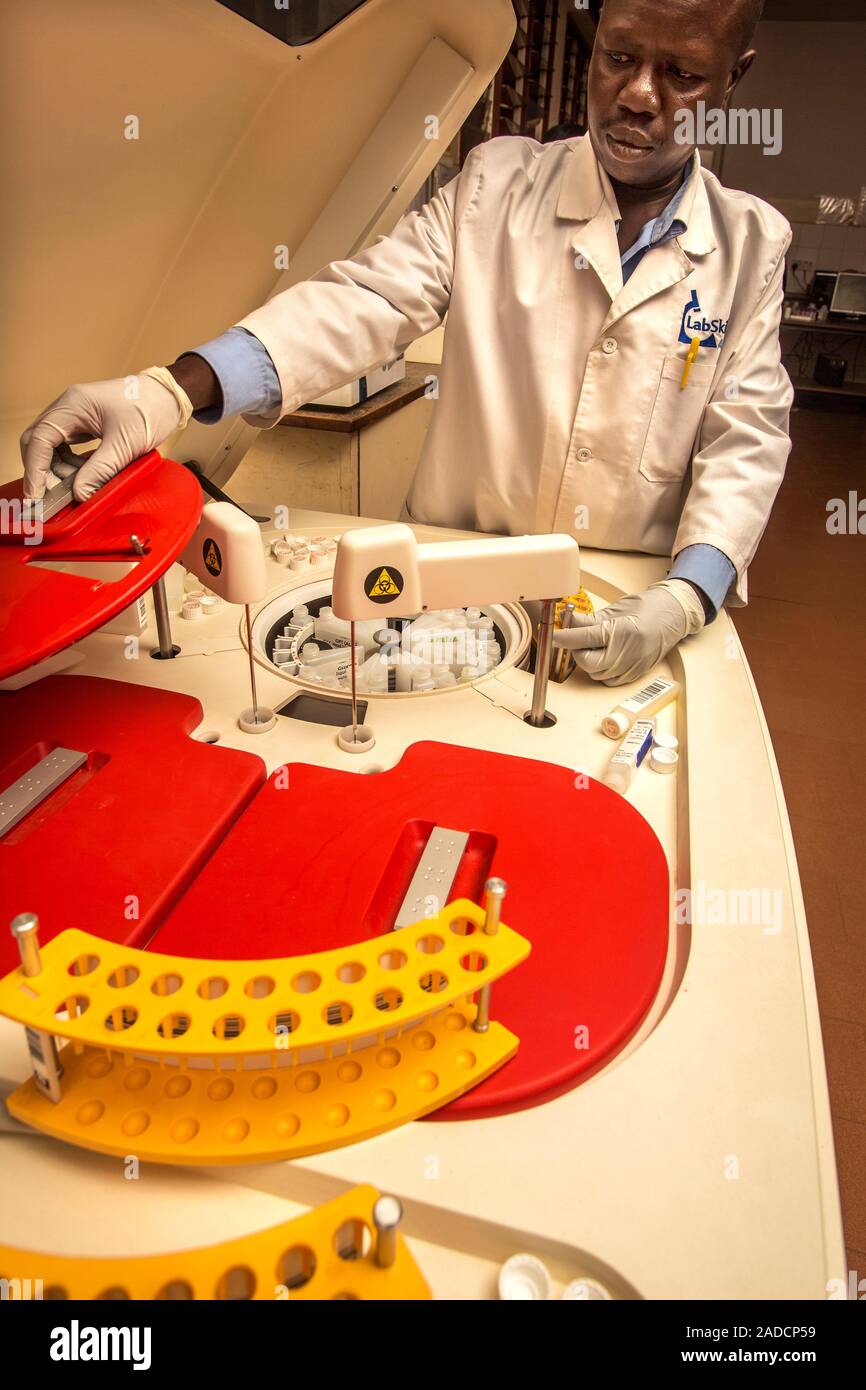 Automated medical analysis. Laboratory technician using an automated ...