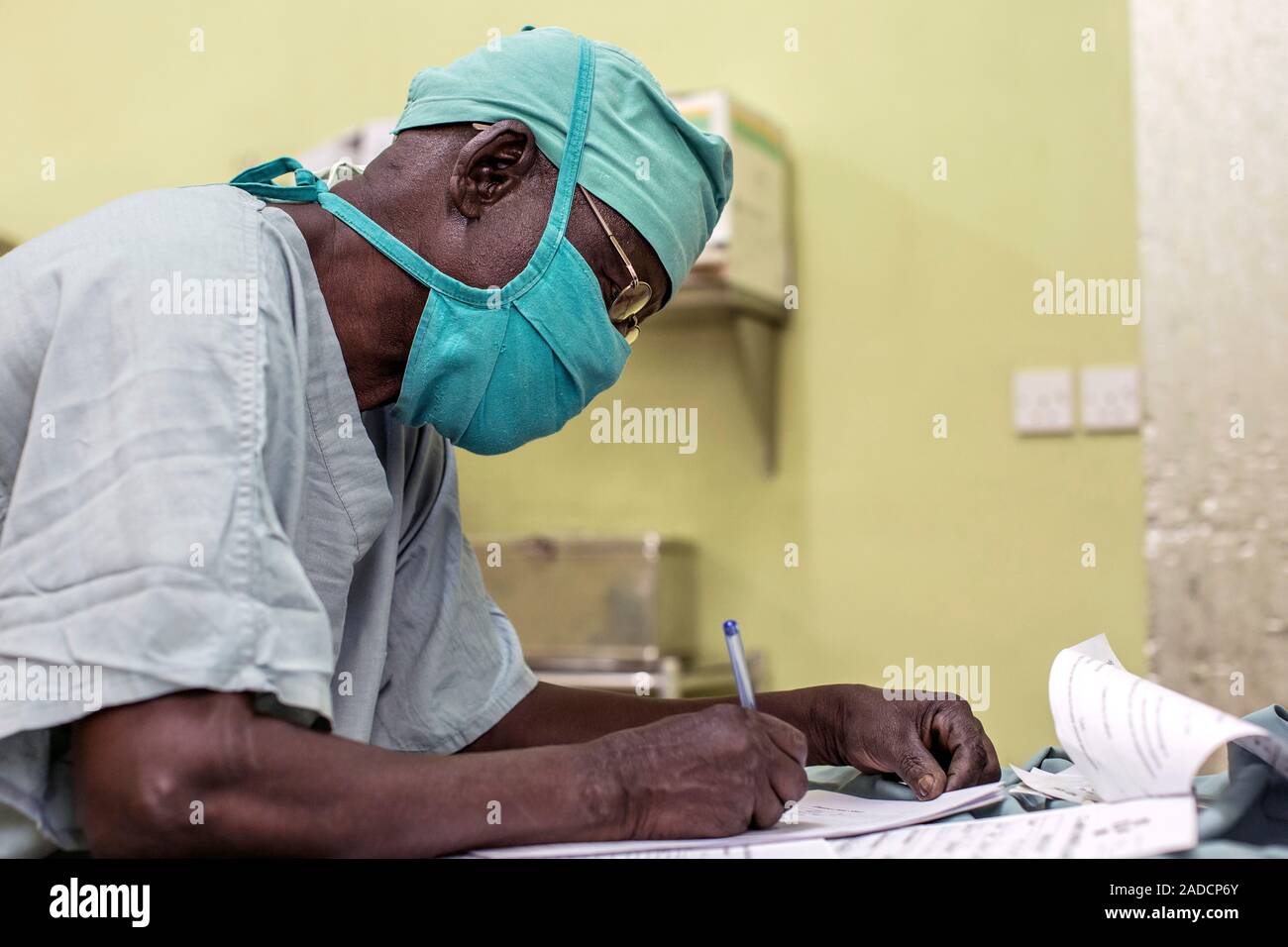 Surgeon writing notes in a hospital. Photographed at St Mary's Hospital ...